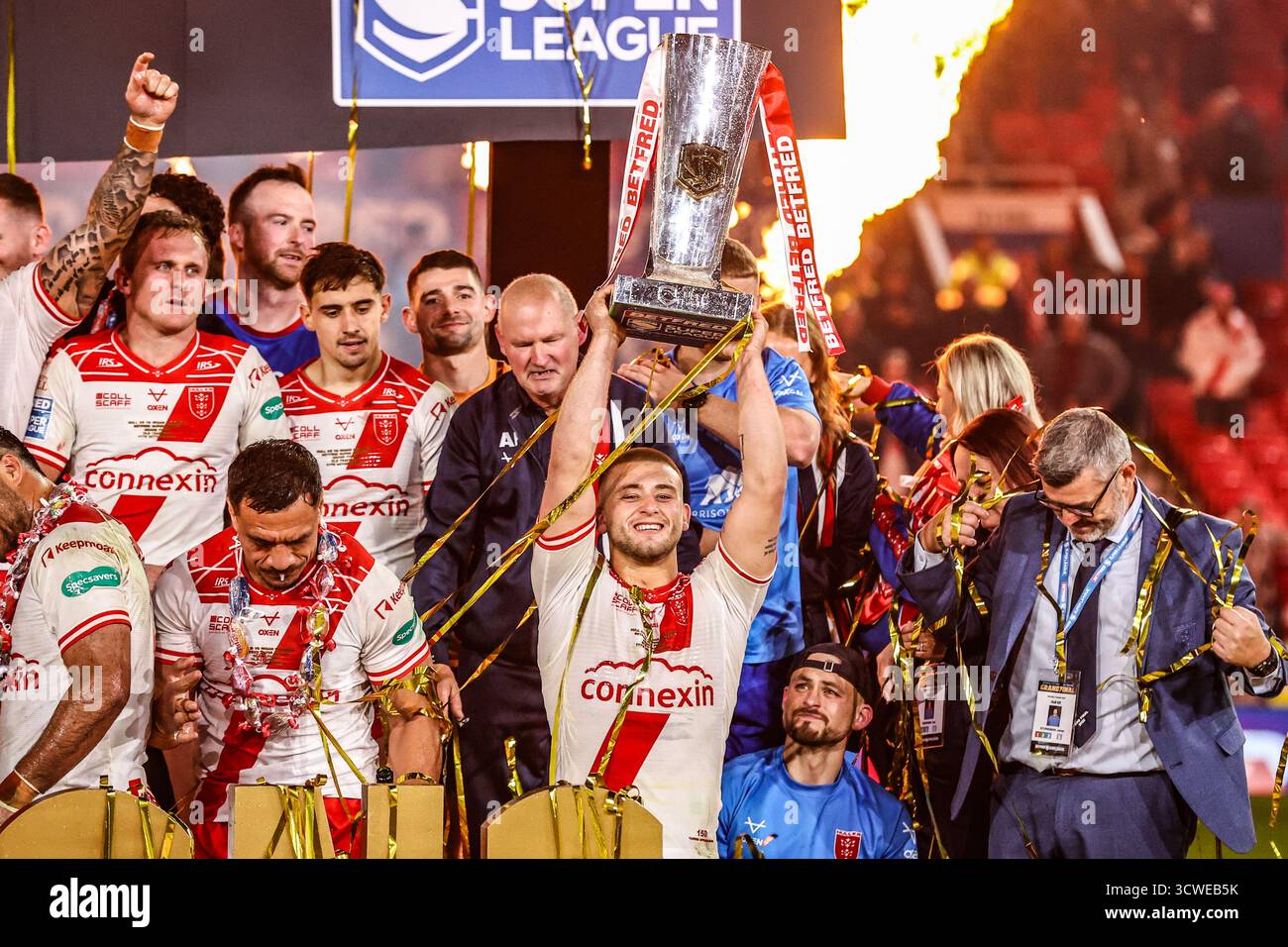 Mikey Lewis of Hull KR lifts the Grand Final Trophy during the 2025 ...