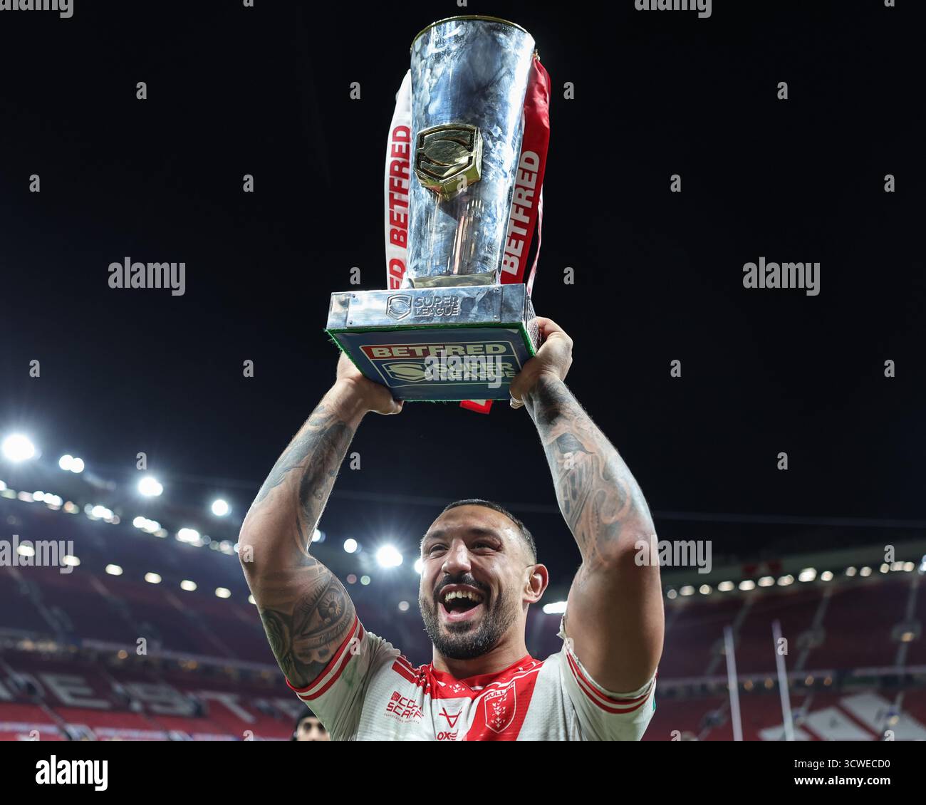 Elliot Minchella of Hull KR lifts the Grand Final Trophy during the ...