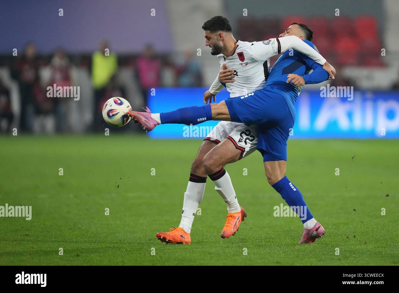 Albania's Armando Broja, left, is challenged by Serbia's Filip Kostic ...