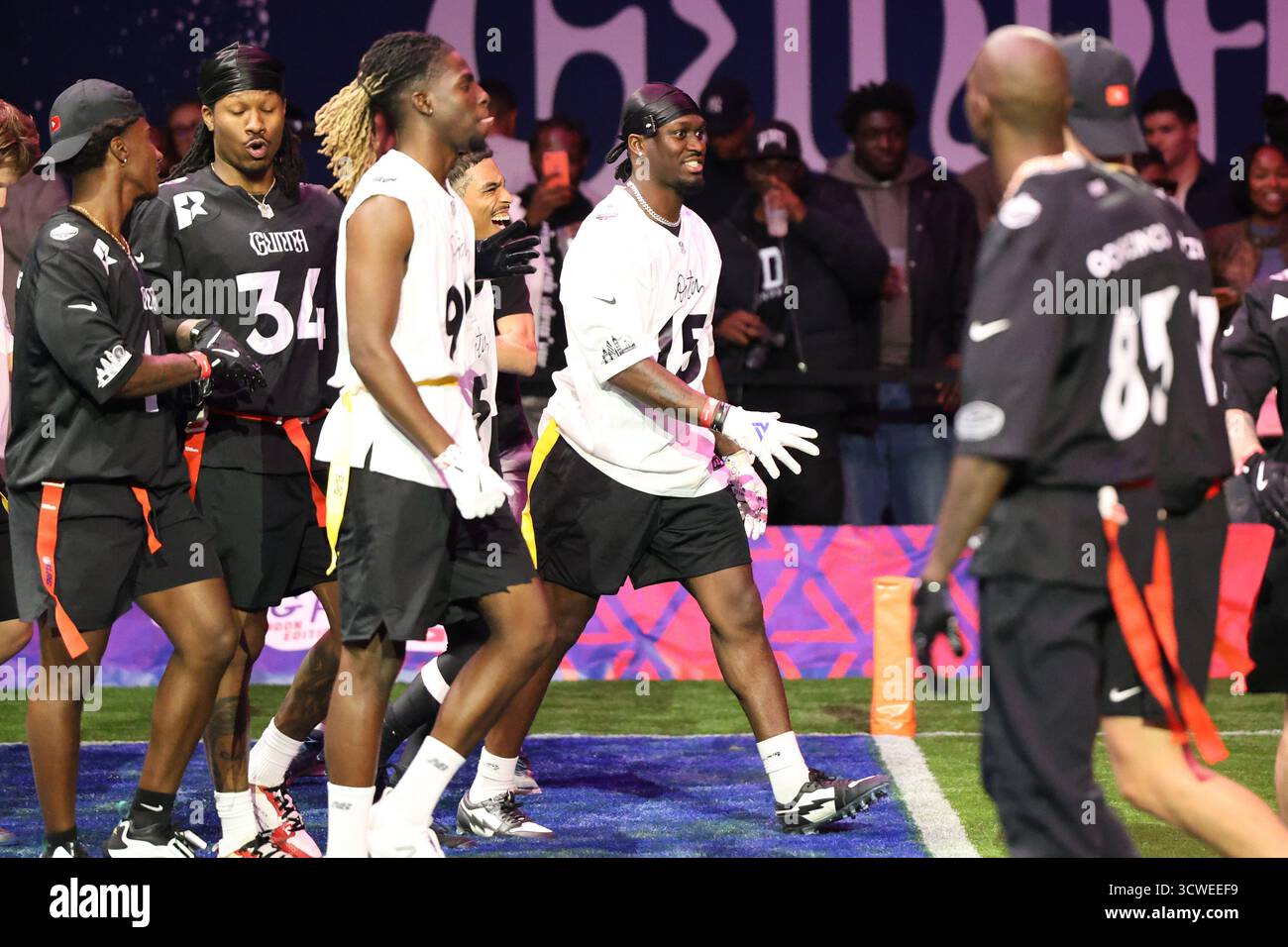 Team Aitch's A.J. Greene (15) celebrates a touchdown against Team Gunna ...