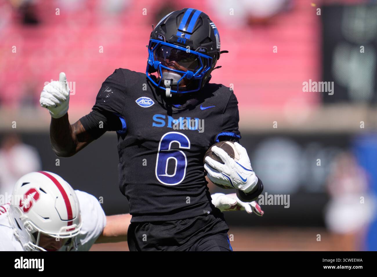 SMU running back Chris Johnson Jr. (6) evades a tackle on the way to ...
