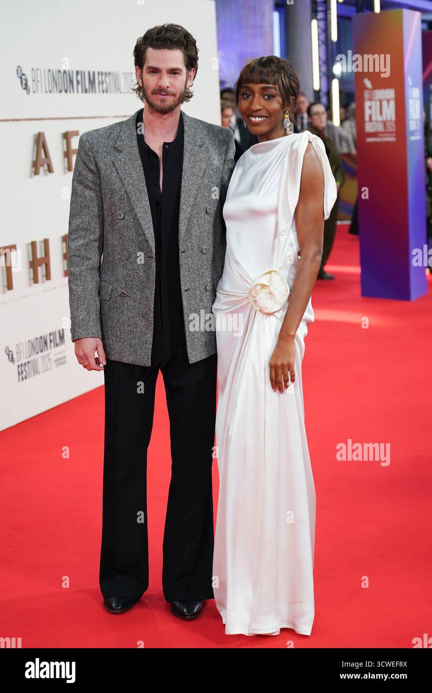 Andrew Garfield, left and Ayo Edebiri pose for photographers upon ...