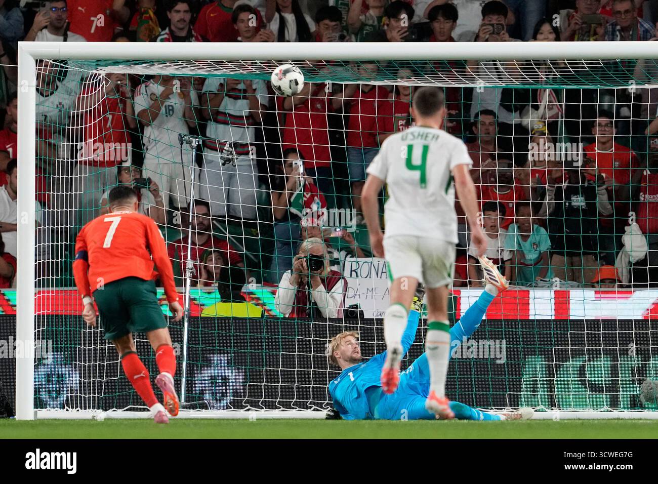 Caoimhin Kelleher goalkeeper of Ireland, bottom, saves a penalty kick ...