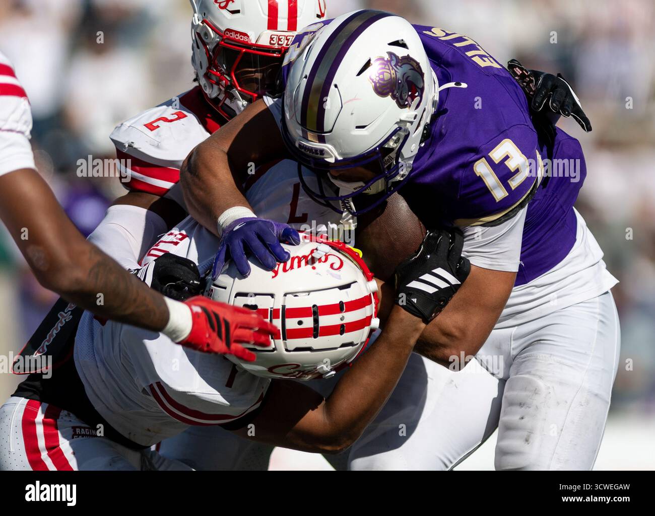 James Madison wide receiver Landon Ellis (13) fights off Louisiana ...