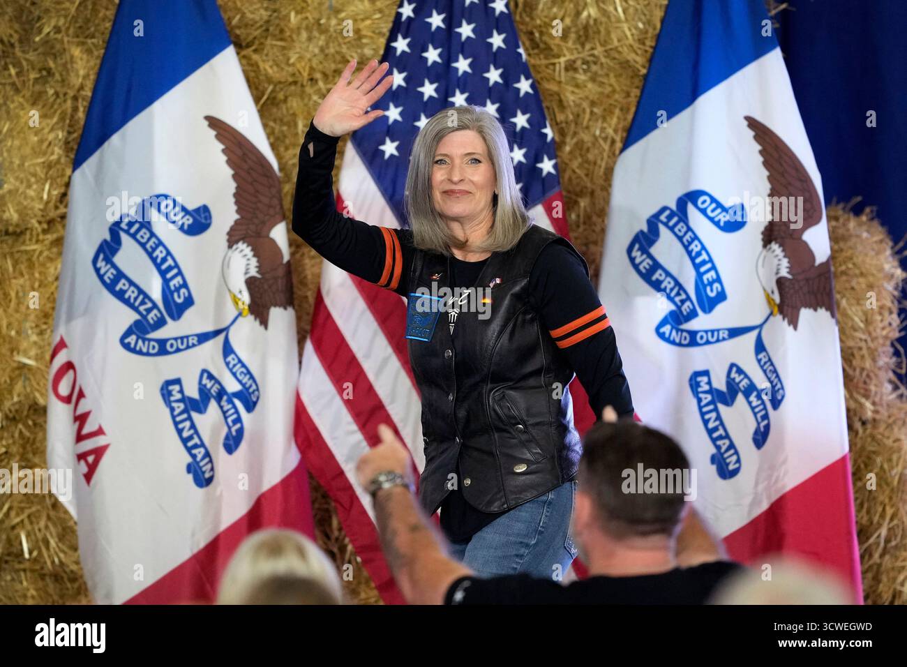 Sen. Joni Ernst, R-Iowa, waves as she arrives at Iowa's Roast and Ride ...
