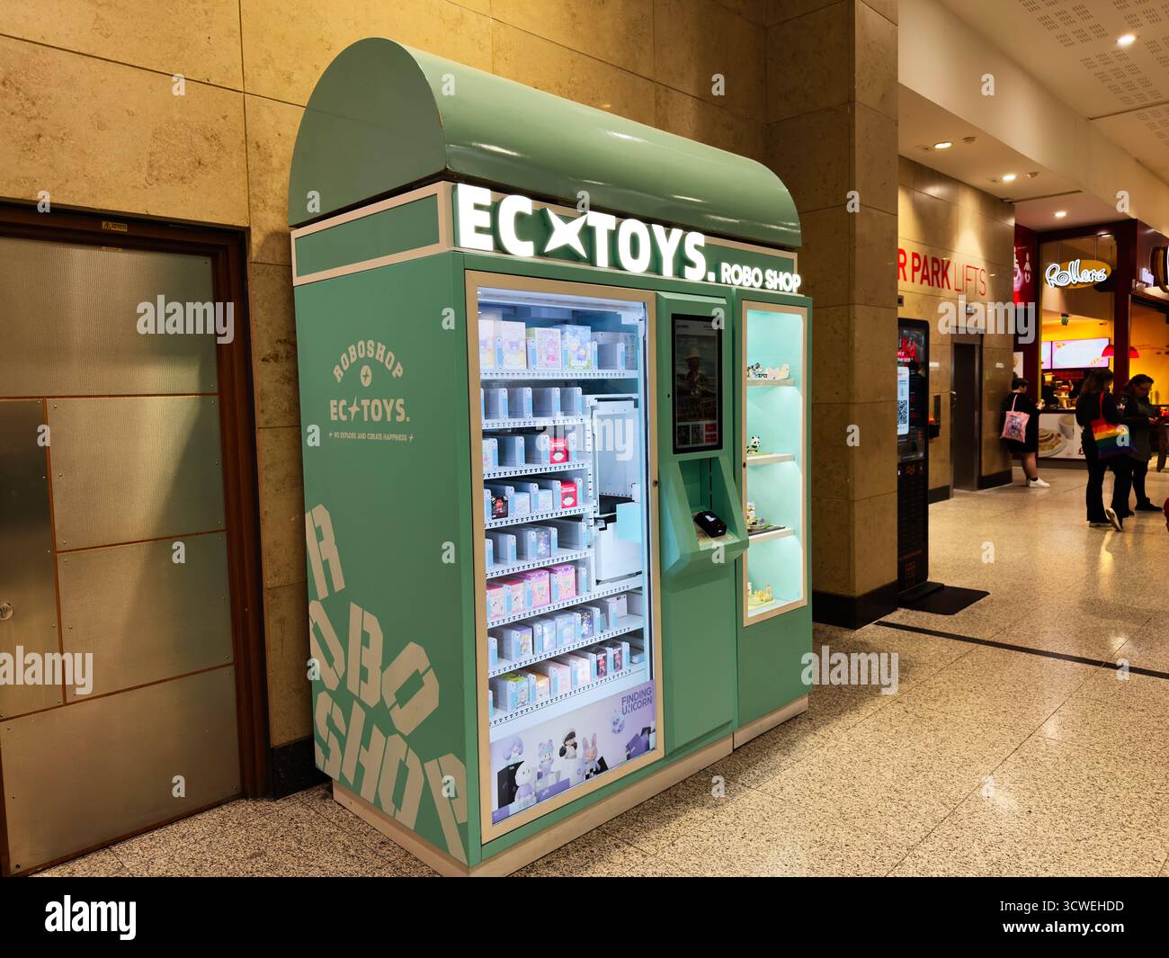 Manchester, UK - September 26, 2025: Bright teal toy shop kiosk in a ...