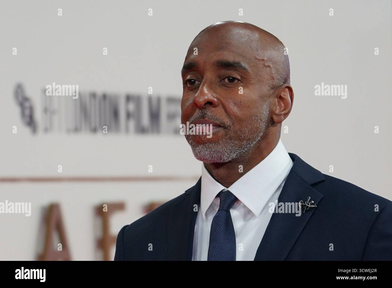 Malik Hassan Sayeed poses for photographers upon arrival at the ...