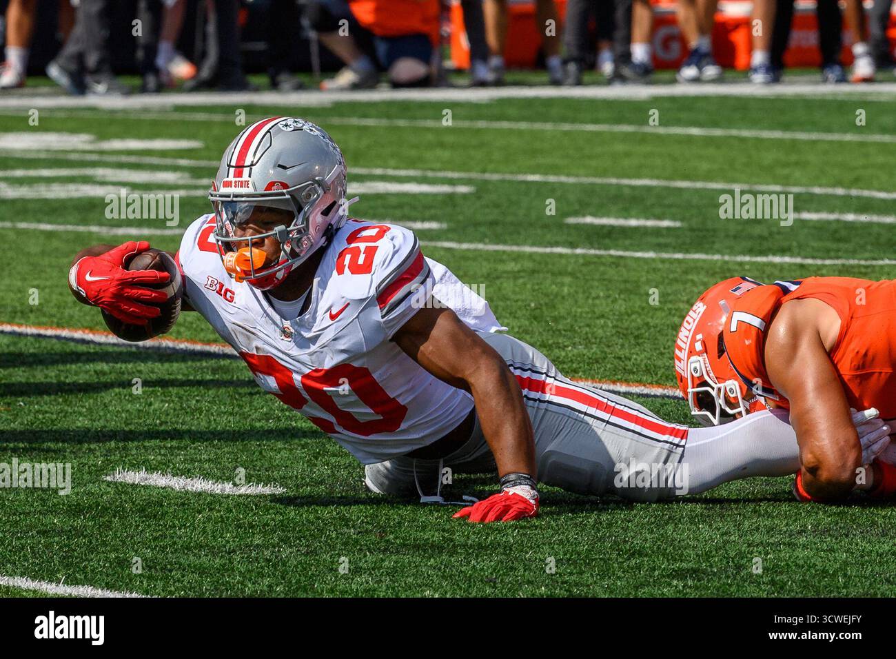Ohio State running back James Peoples (20) stretches for extra yardage ...