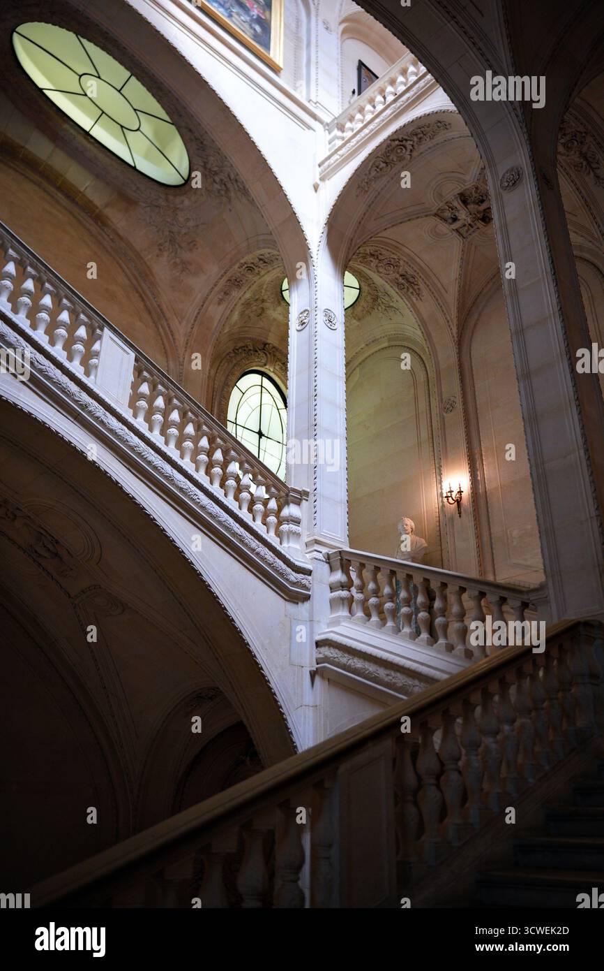 Architectural staircase with arches and natural light Louvre Museum ...