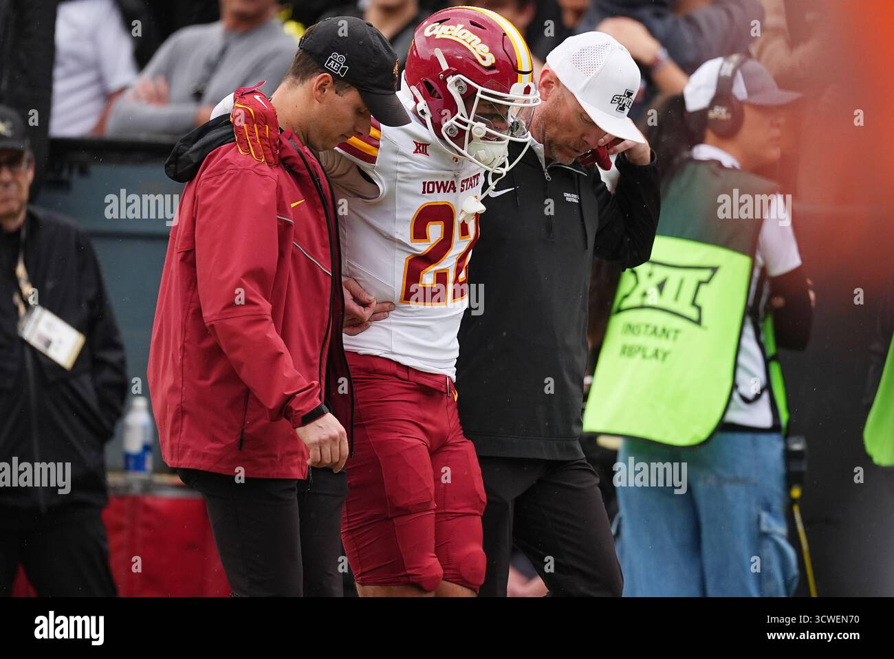 Iowa State running back Ryver Peppers is helped off the field after ...