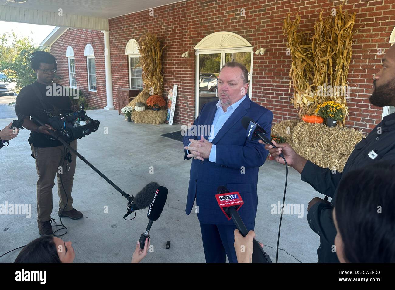 Tim Farris, senior pastor at Hurricane Chapel, speaks with media after ...