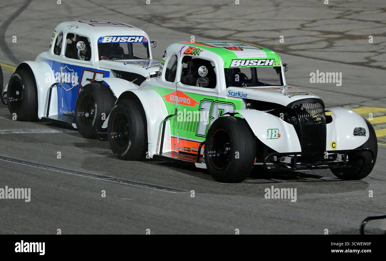 LAS VEGAS, NV - OCTOBER 11: Ten year old Brexton Busch (18) leads his father Kyle Busch (51 ...
