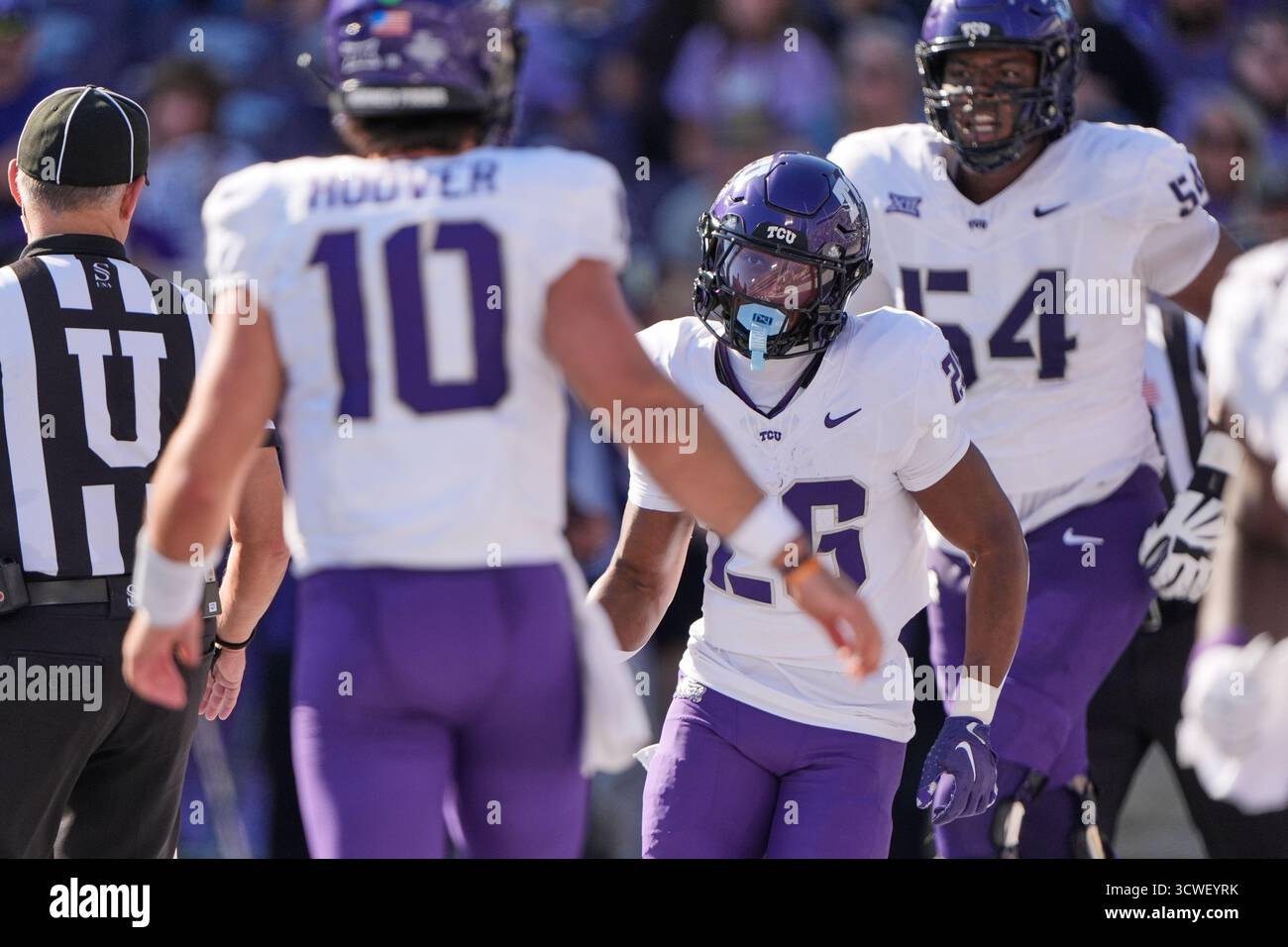 TCU running back Jeremy Payne, center, runs off the field after scoring ...