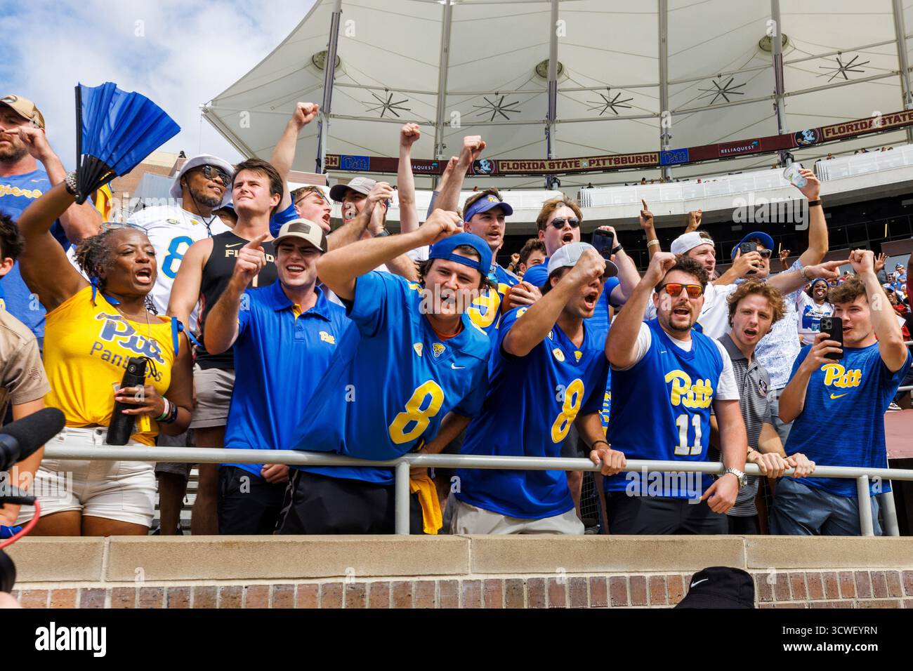 Pittsburgh fans celebrate after their team defeated Florida State in an ...