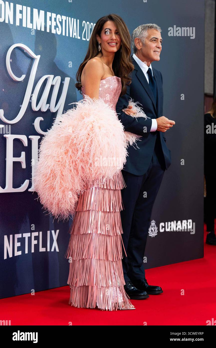 Amal Clooney, left, and George Clooney pose for photographers upon ...