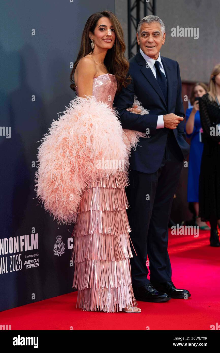 Amal Clooney, left, and George Clooney pose for photographers upon ...