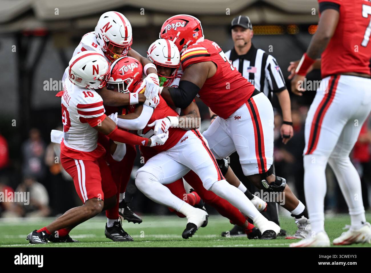 Maryland running back Nolan Ray (2) is tackled by a group of Nebraska ...