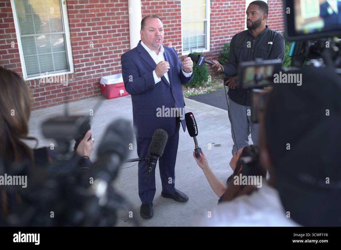 Tim Farris, Hurricane Chapel senior pastor, speaks to the press after a ...