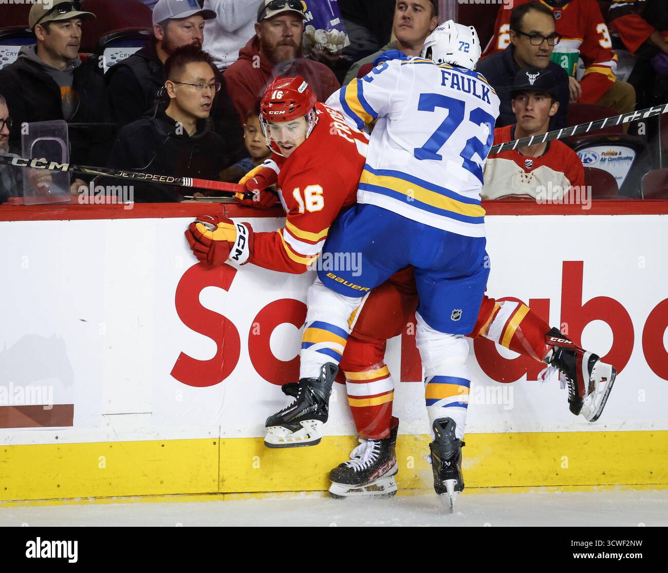 St. Louis Blues' Justin Faulk, right, checks Calgary Flames' Morgan ...