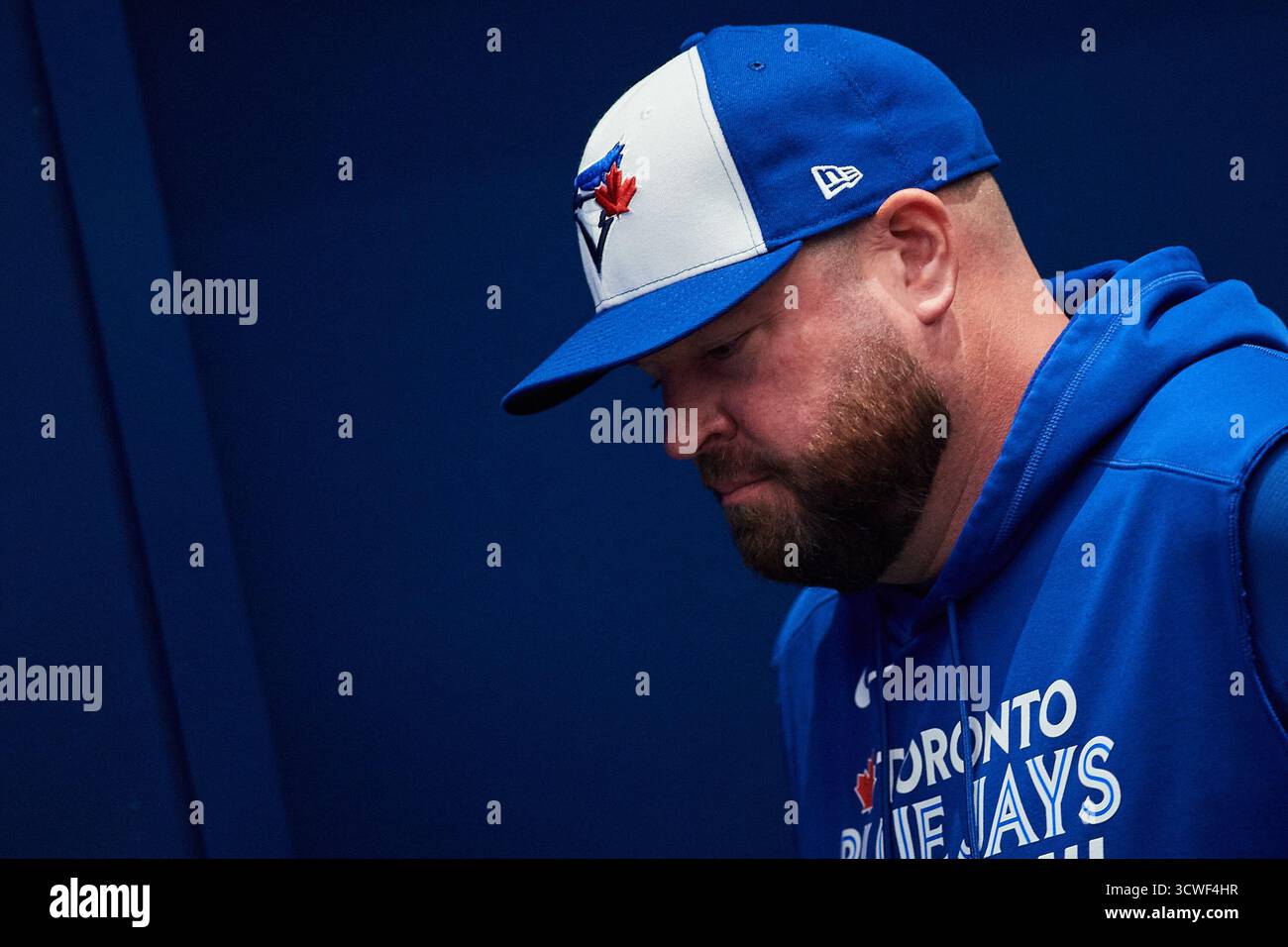 Toronto Blue Jays manager John Schneider arrives to speak with the ...