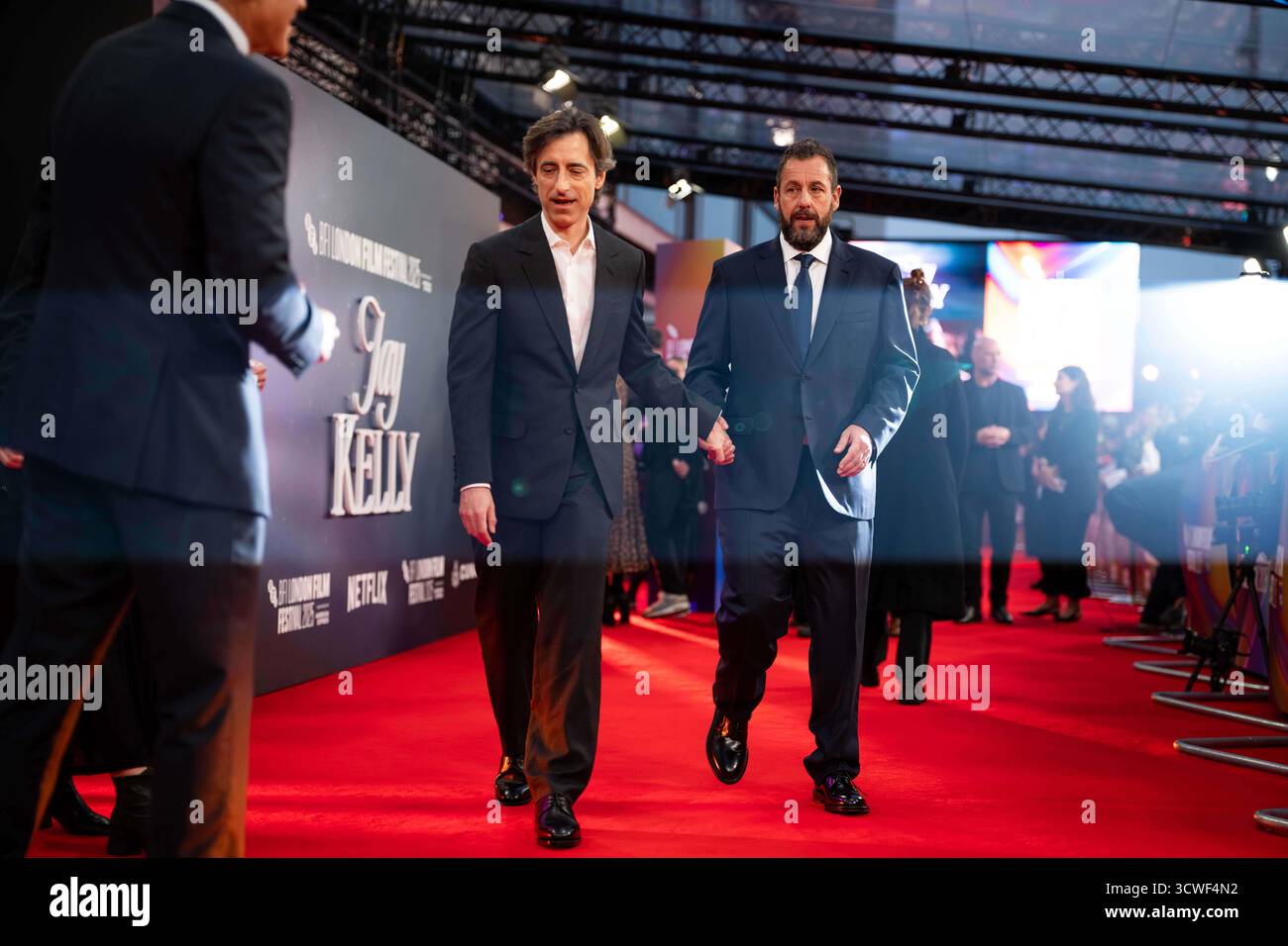 Director Noah Baumbach, left, and Adam Sandler pose for photographers ...