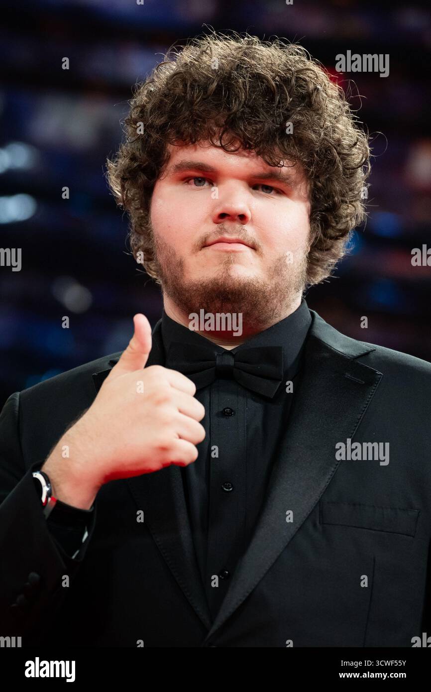Aidan Delbis poses for photographers upon arrival at the premiere of ...