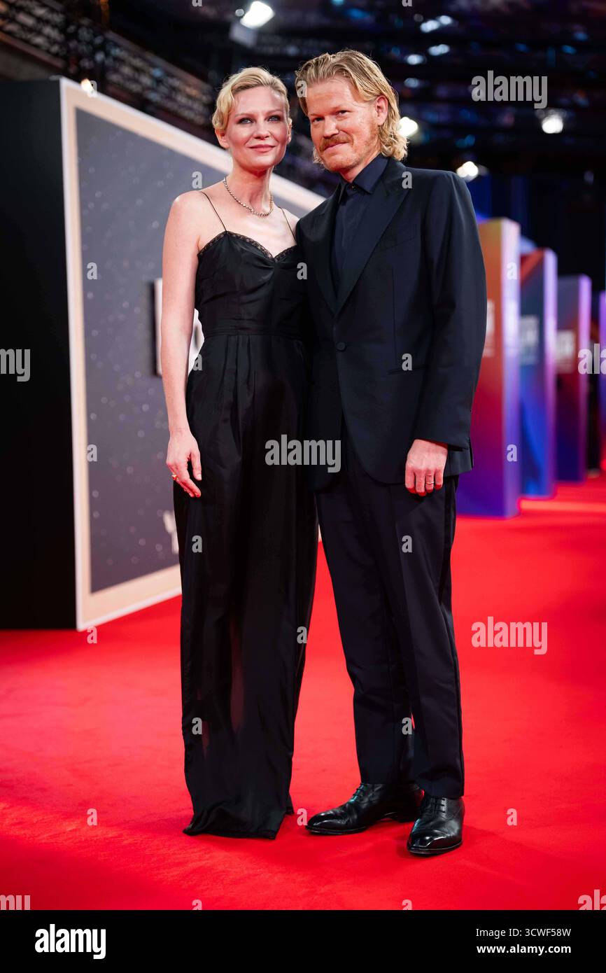 Kirsten Dunst, left, and Jesse Plemons pose for photographers upon ...