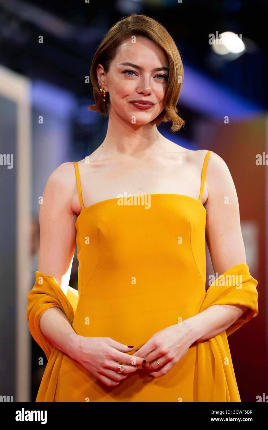 Emma Stone poses for photographers upon arrival at the premiere of the ...