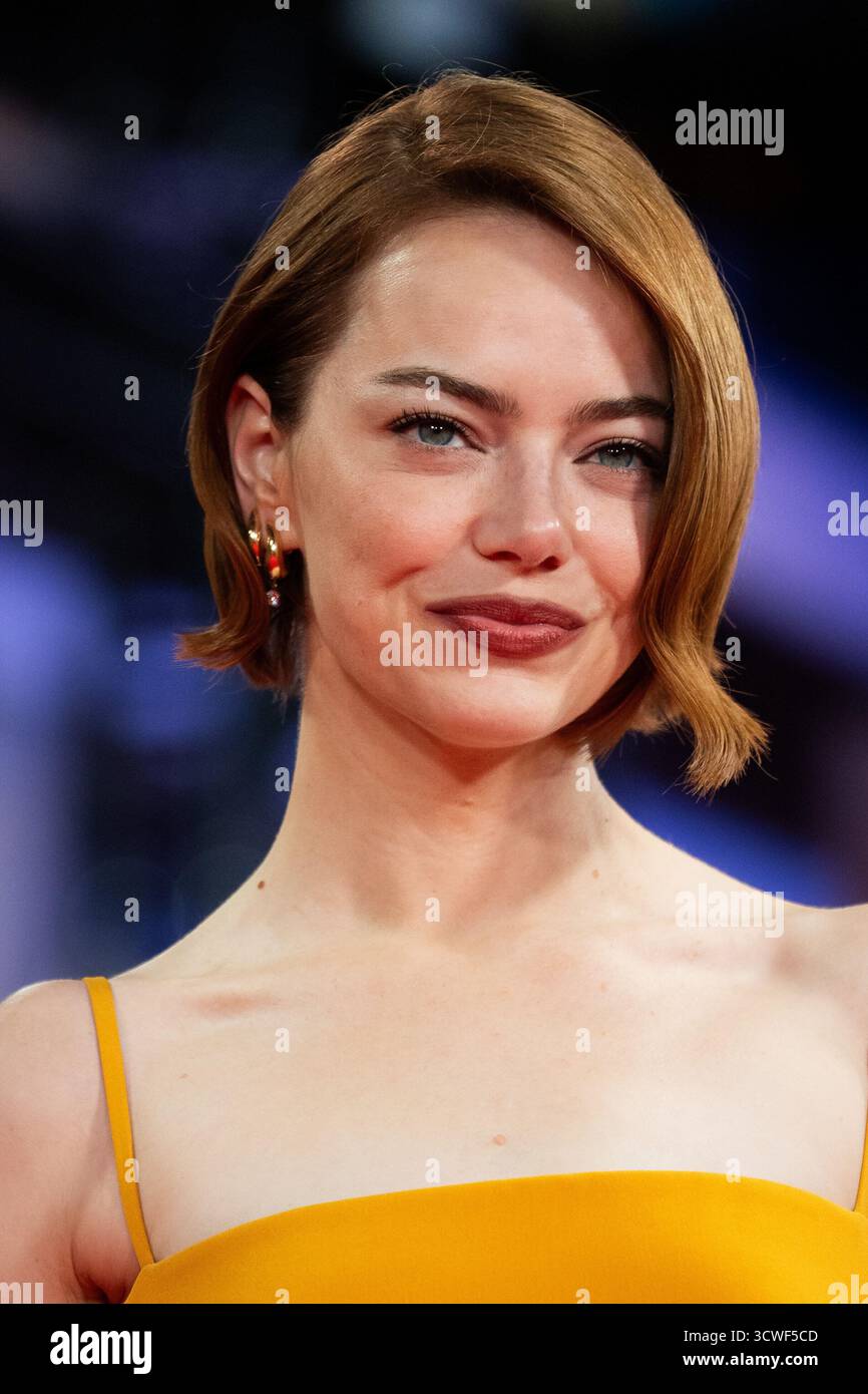 Emma Stone poses for photographers upon arrival at the premiere of the ...