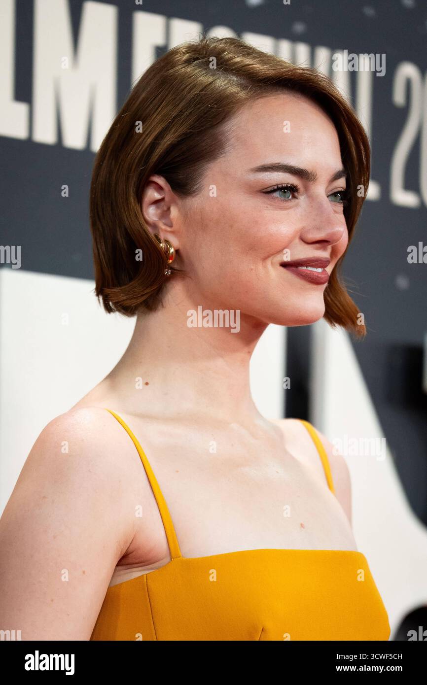 Emma Stone poses for photographers upon arrival at the premiere of the ...