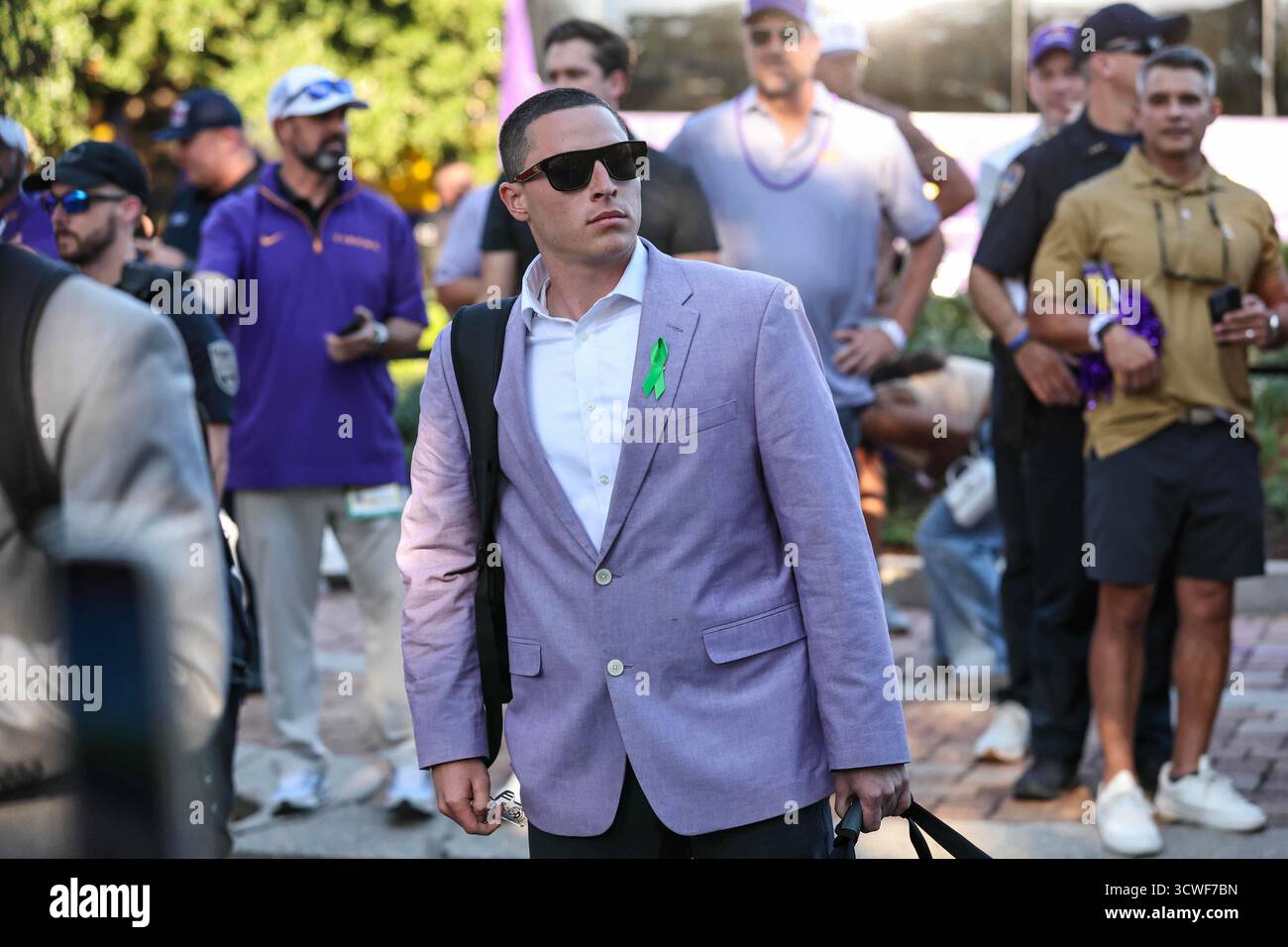 October 09, 2025: LSU assistant coach Jason Curtis gets ready to walk ...