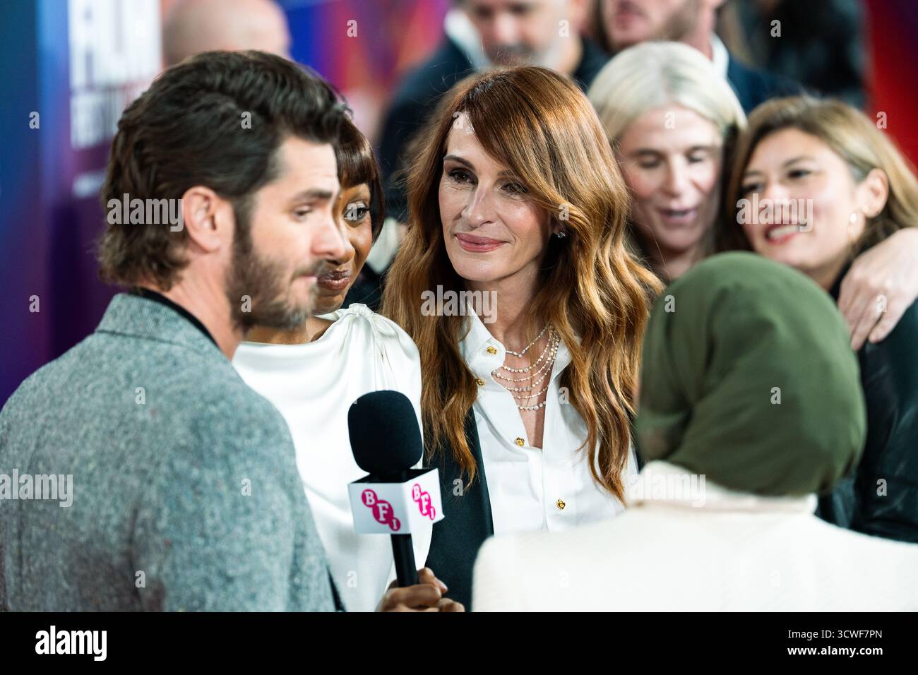 (L-R) Andrew Garfield, Ayo Edebiri, and Julia Roberts attend the "After ...