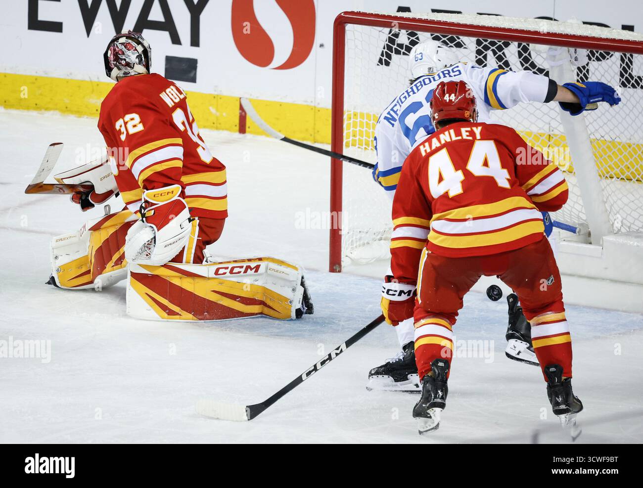 St. Louis Blues' Jake Neighbours (63) scores on Calgary Flames goalie ...