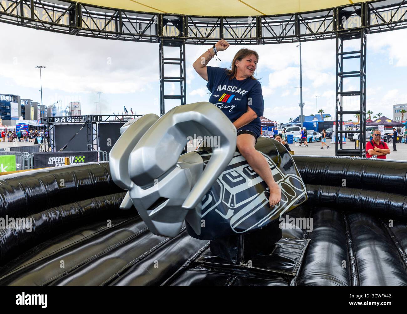 LAS VEGAS, NV - OCTOBER 11: A fan rides a mechanical RAM in the Dodge ...