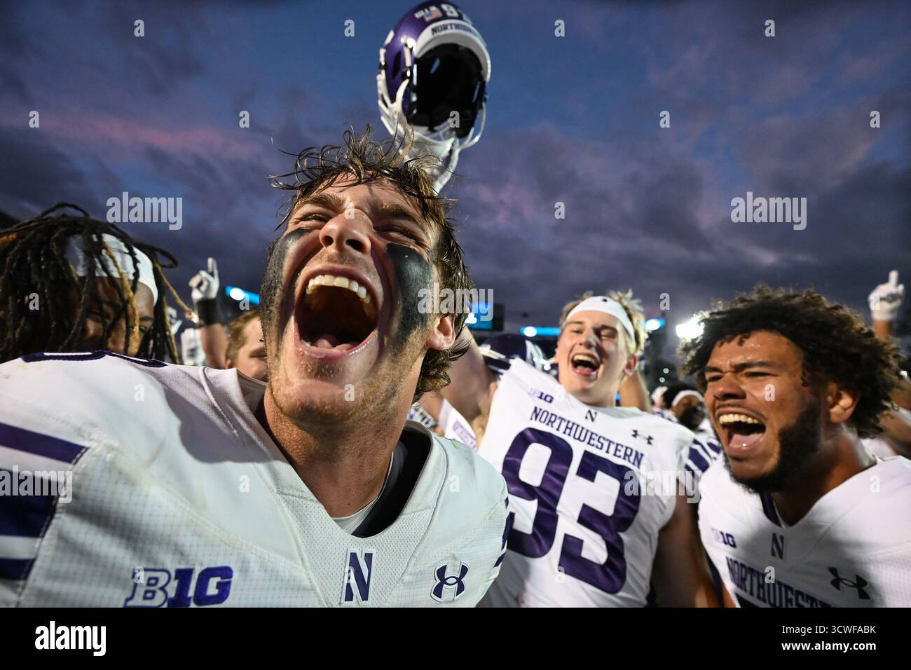 Northwestern quarterback Preston Stone (8) and defensive lineman Caden ...