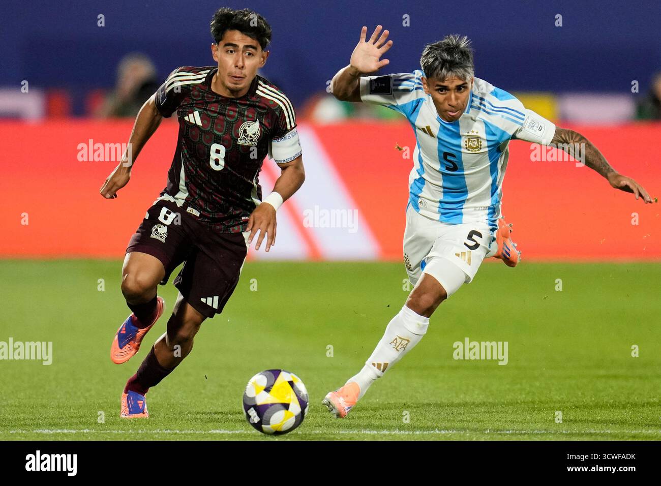 Argentina's Milton Delgado (5) and Mexico's Elias Montiel battle for ...