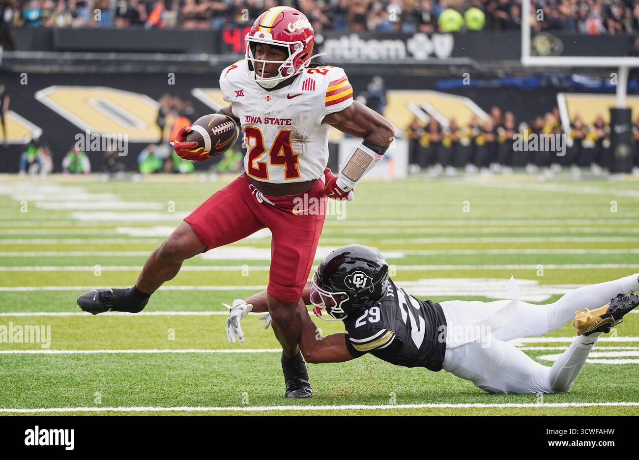 Iowa State running back Abu Sama, left, eludes Colorado defensive back ...