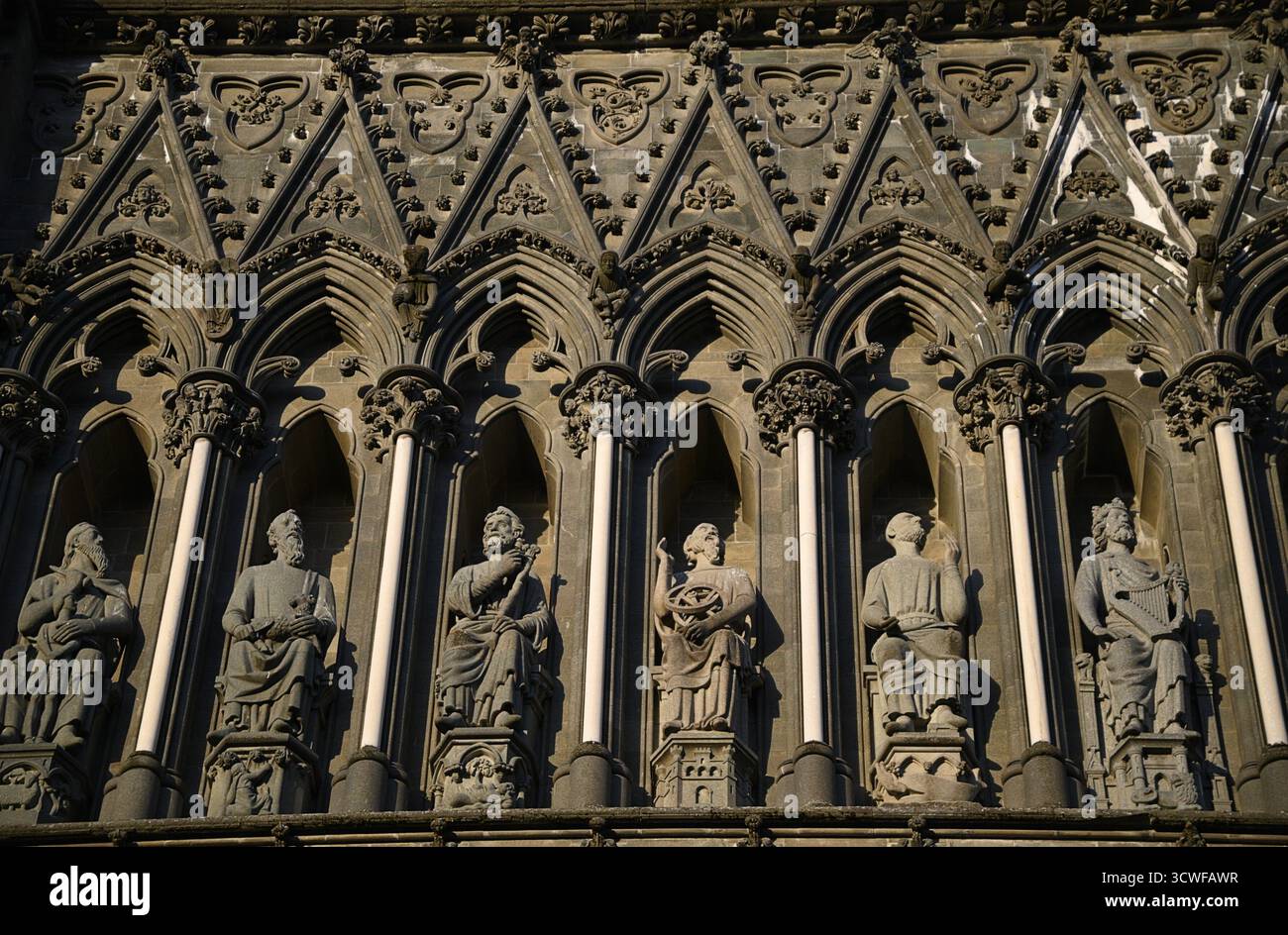 Religious sculpted statues on the west front of the Romanesque Gothic ...