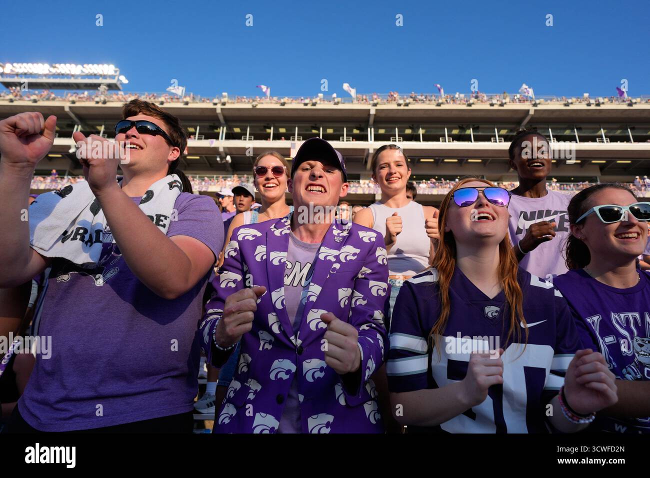 Kansas State fans cheer during the second half of an NCAA college ...