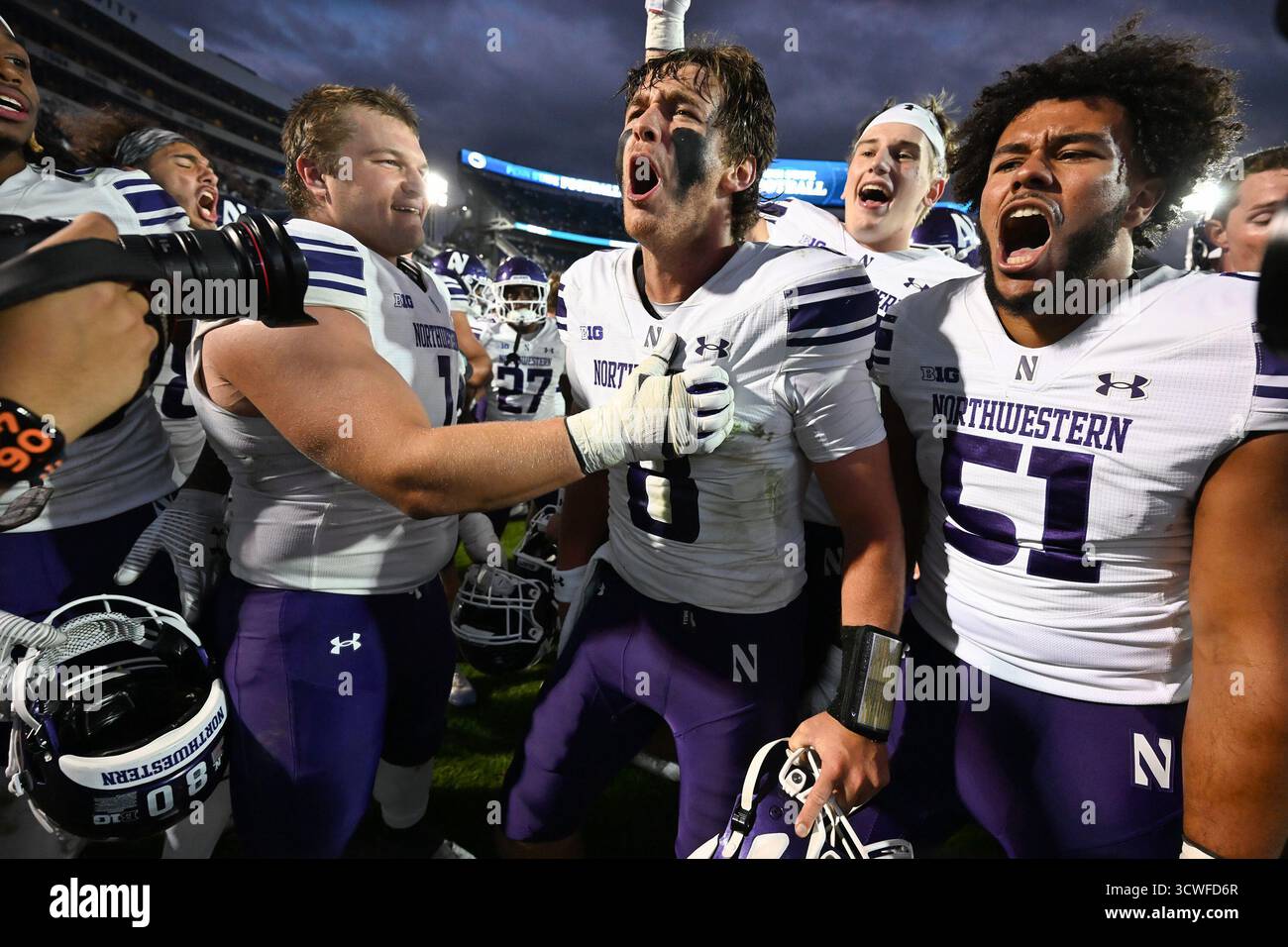 Northwestern quarterback Preston Stone (8) and Northwestern linebacker ...