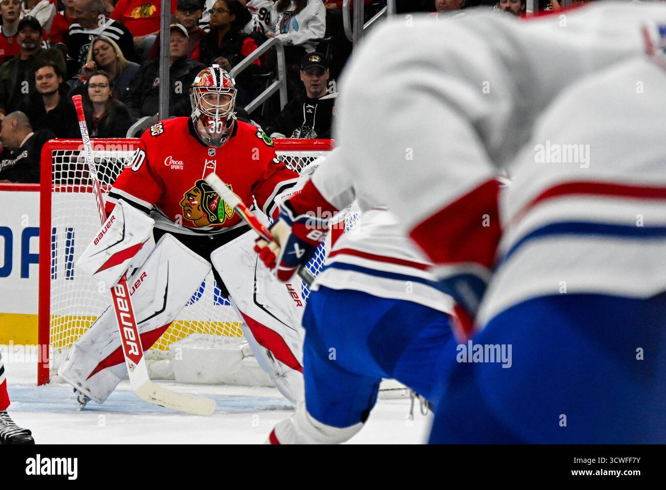 Chicago Blackhawks goaltender Spencer Knight defends during the first ...