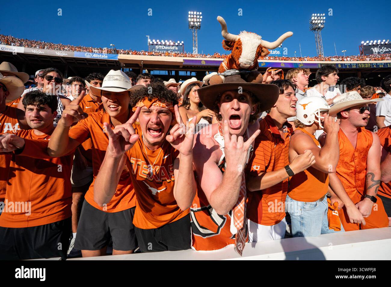 Texas fans cheer during the second half of an NCAA college football ...