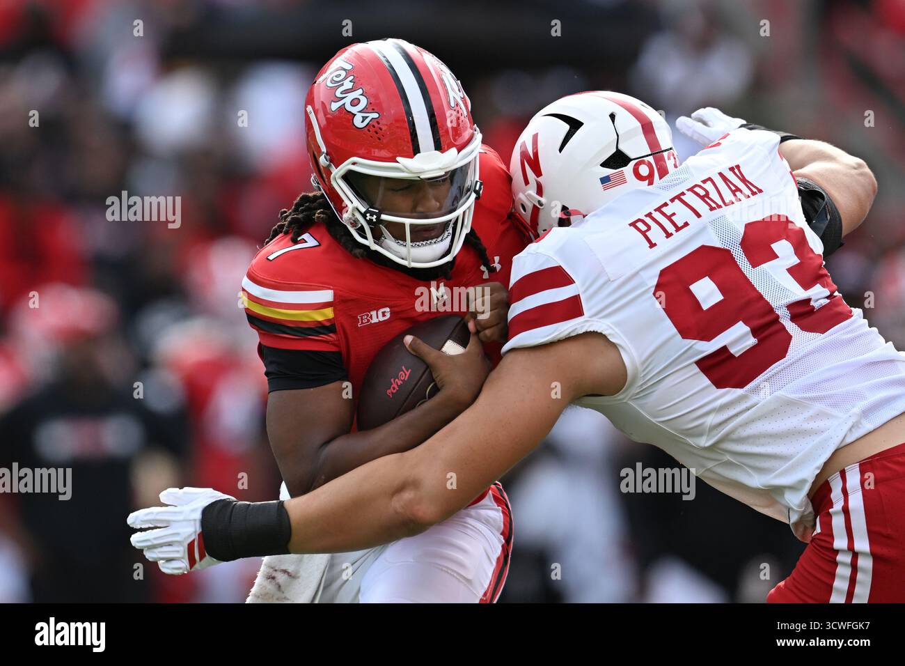 Maryland quarterback Malik Washington (7) is sacked by Nebraska ...