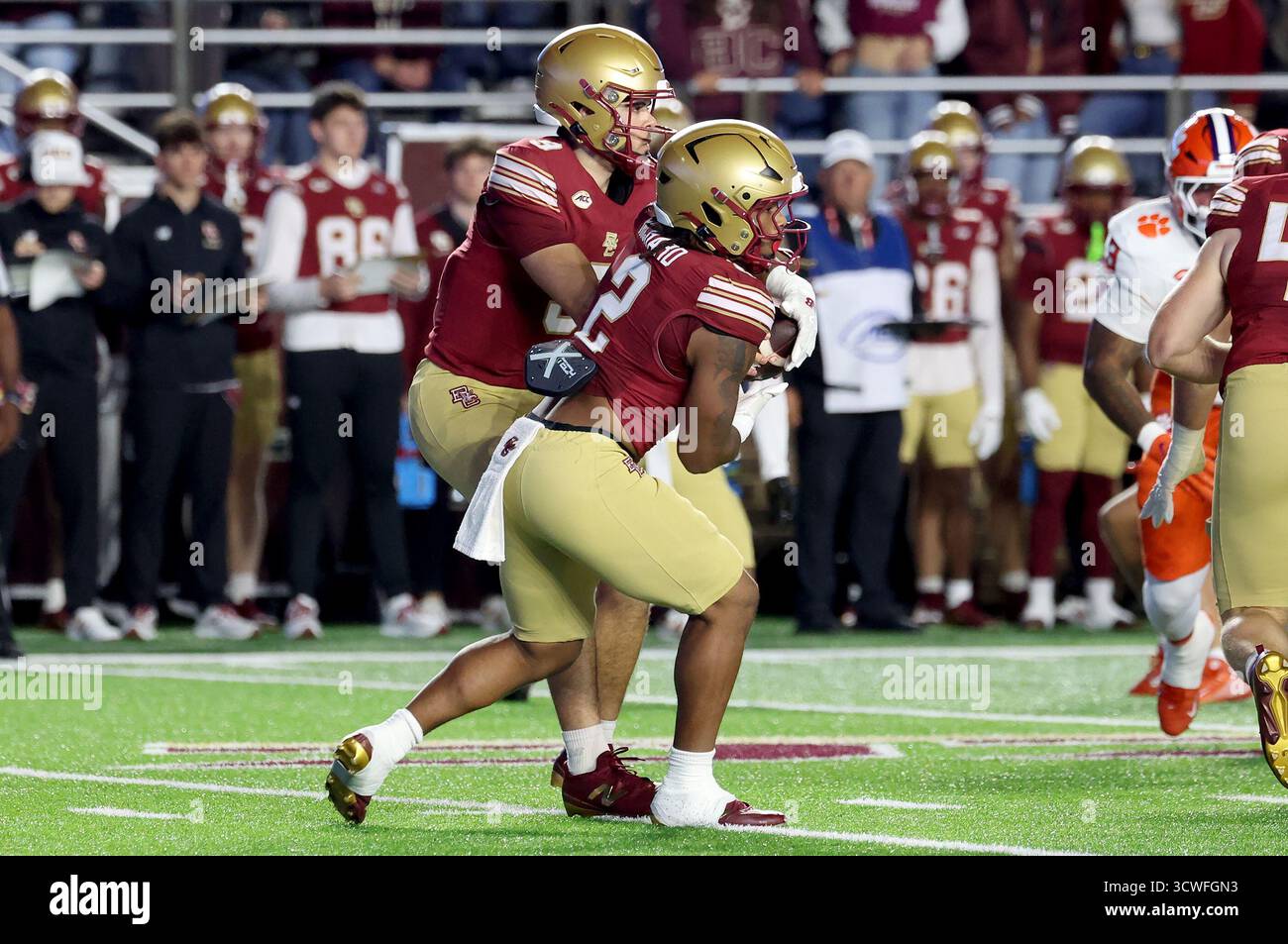 Boston College quarterback Dylan Lonergan (9) hands the ball off to ...