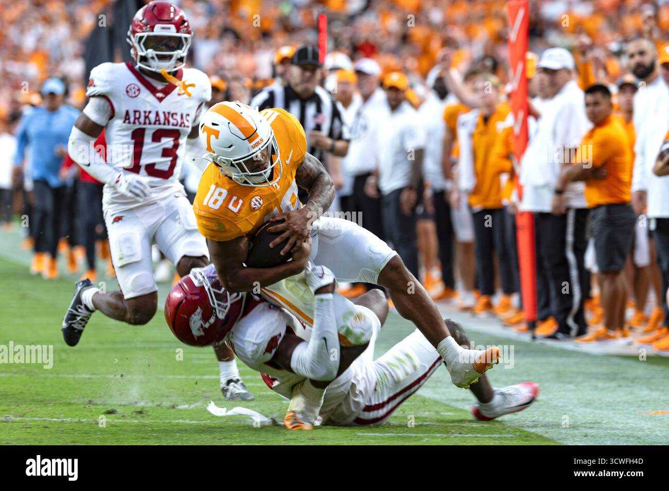 Tennessee running back Desean Bishop (18) is tackled by Arkansas ...