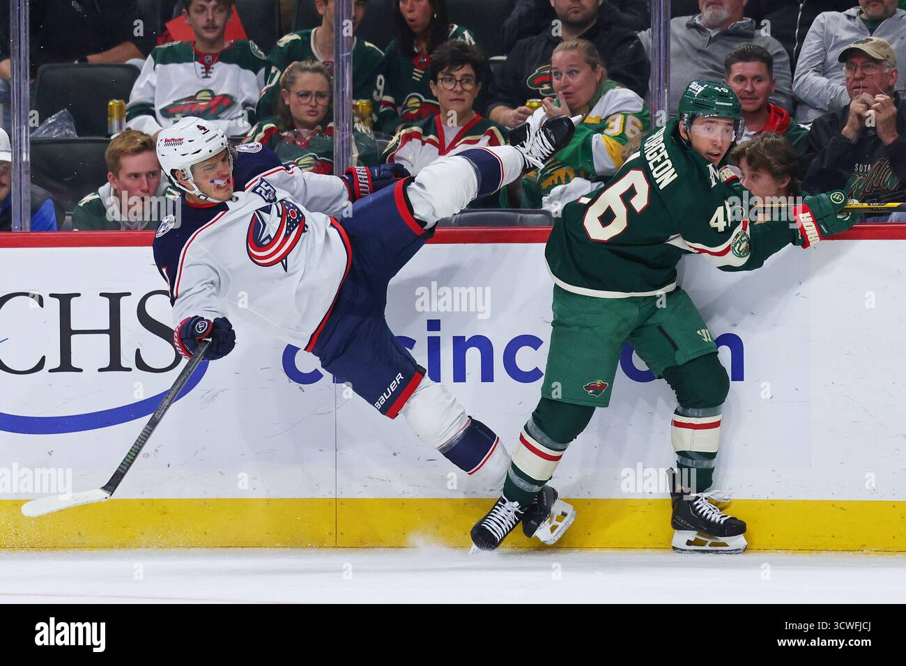 Columbus Blue Jackets center Cole Sillinger (4) loses his balance after ...