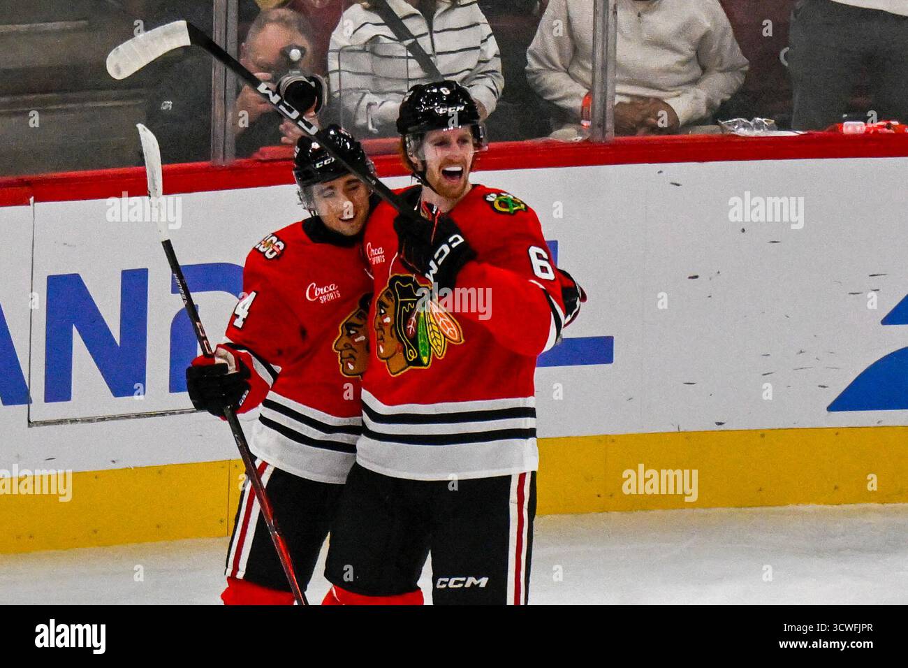 Chicago Blackhawks Wyatt Kaiser (44) celebrates with Sam Rinzel (6 ...