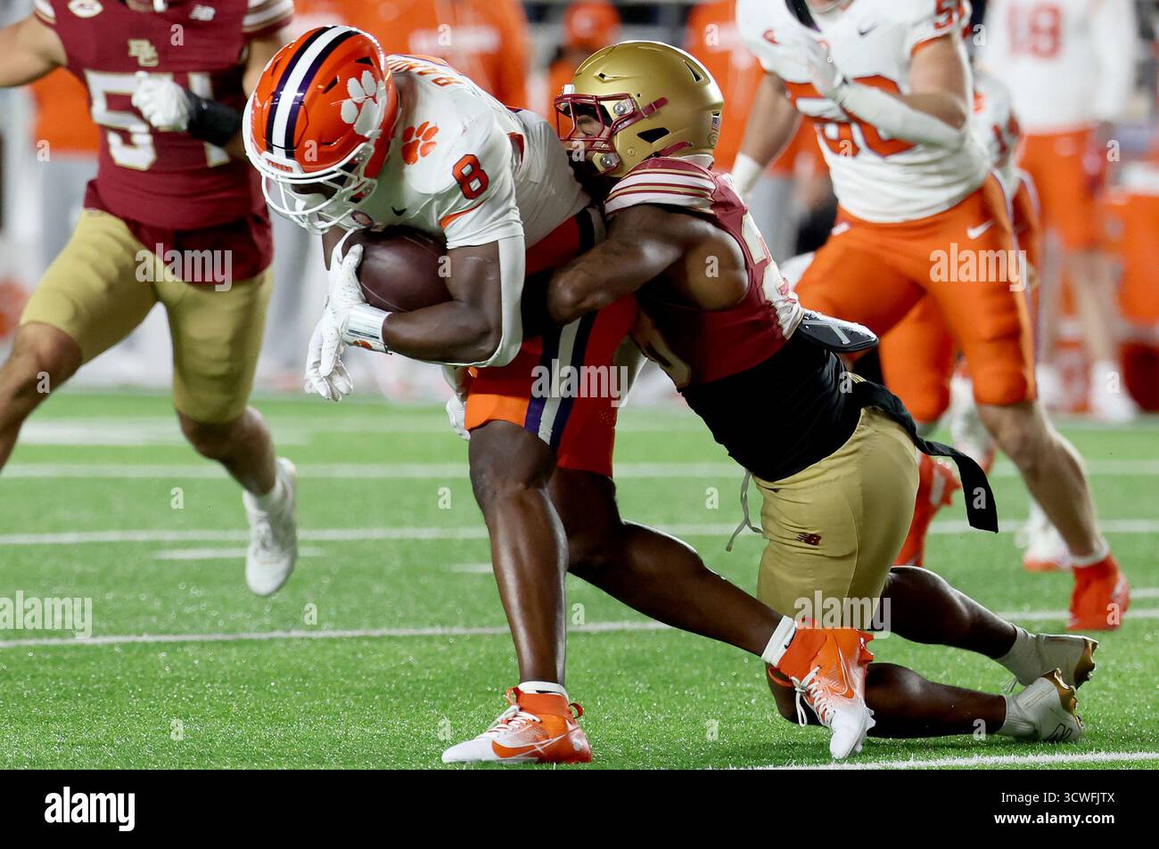 Boston College linebacker Zacari Thomas, right, tackles Clemson running ...