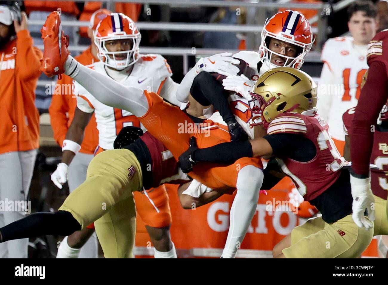 Clemson wide receiver Bryant Wesco Jr., is upended and tackled by ...