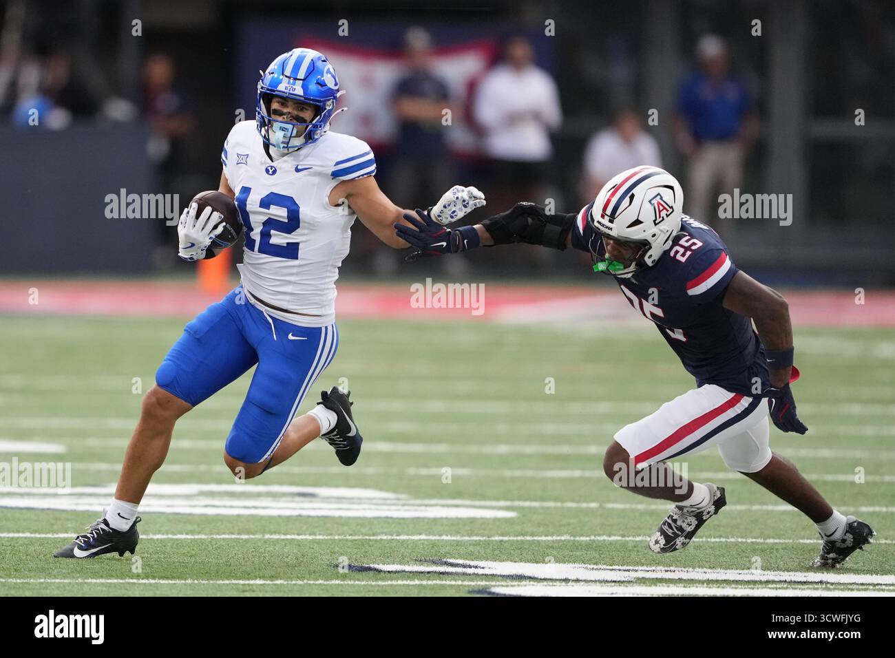 BYU running back Preston Rex avoids Arizona defensive back Michael ...